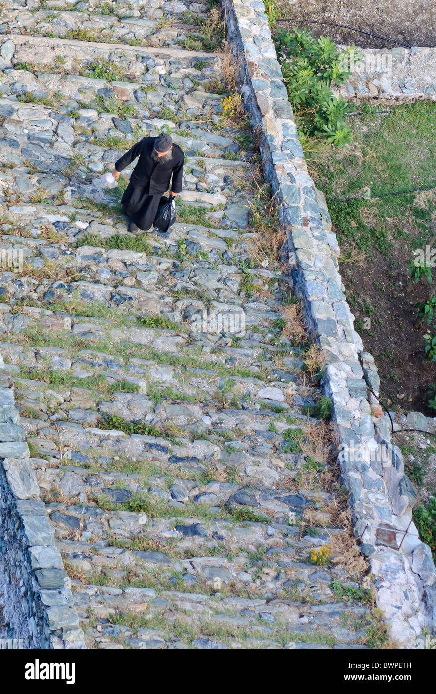 Monk walking up stairs hi-res stock photography and images - Alamy
