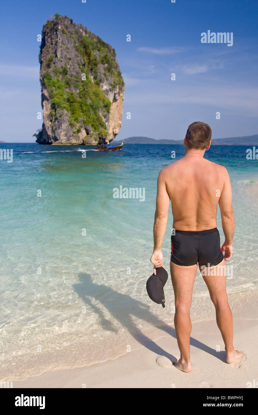 Man on beach Stock Photo - Alamy