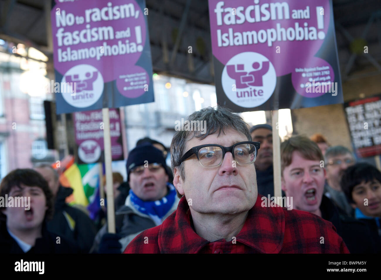 Members of Unite Against Facism (UAF) counter-protest against the ...