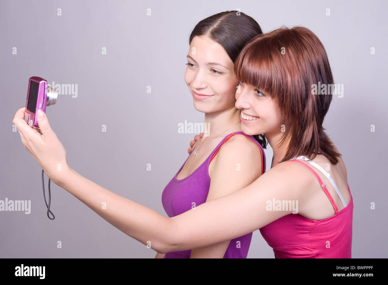 Two girls and a camera Stock Photo - Alamy