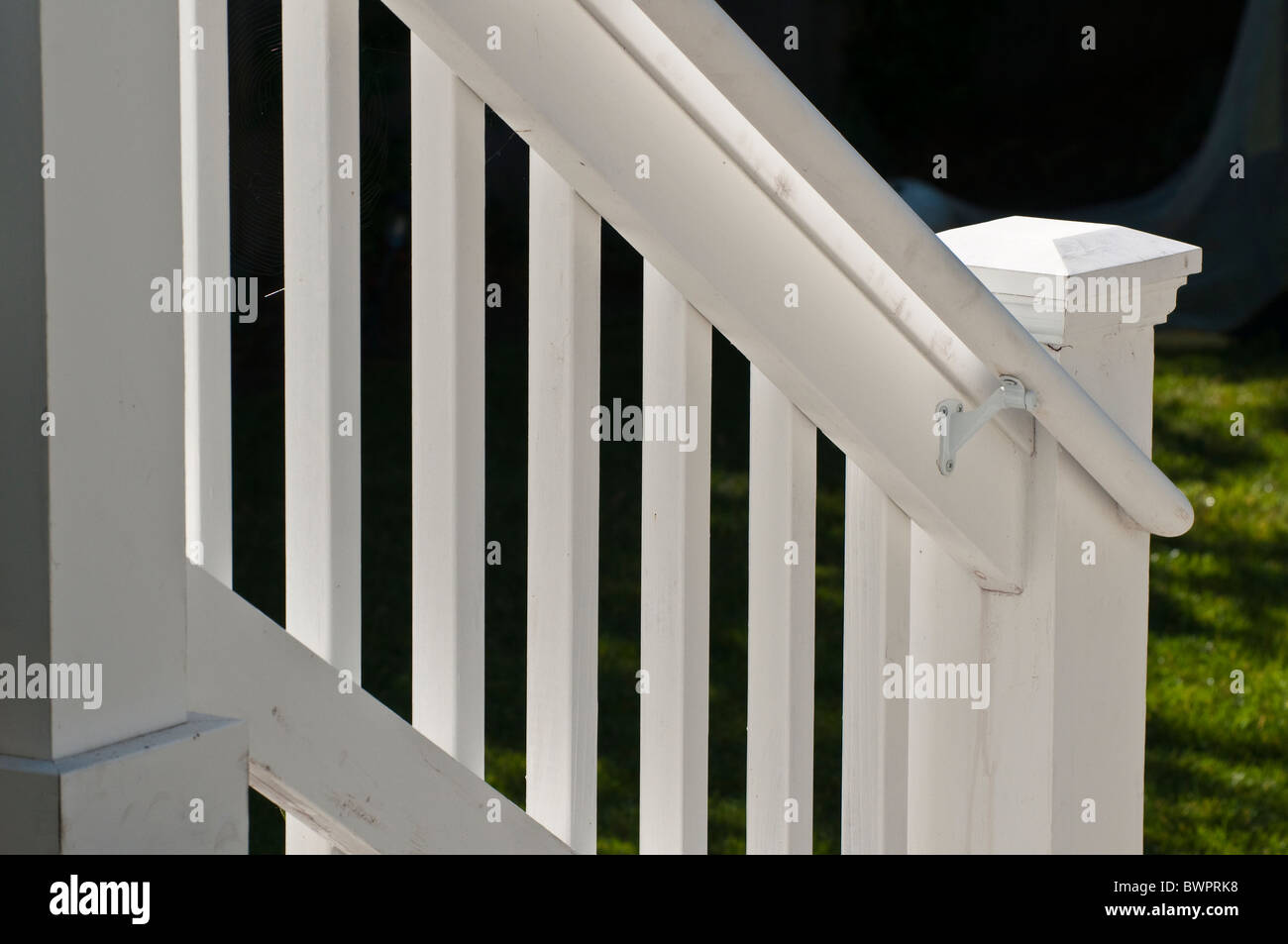 White railing on backyard porch Stock Photo - Alamy