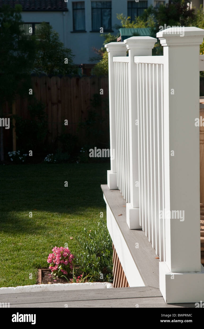White railing on backyard porch Stock Photo - Alamy