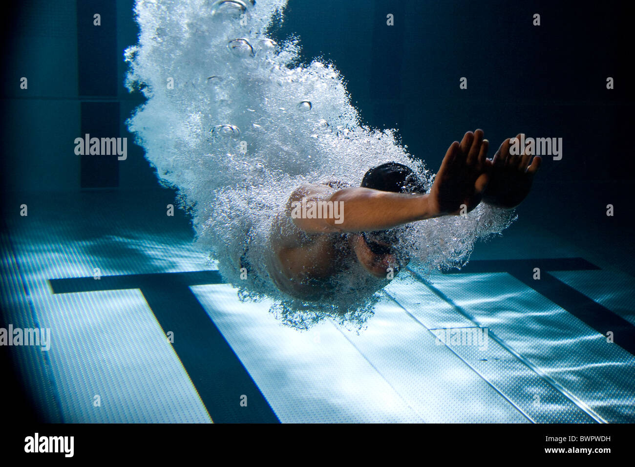 professional swimmer underwater after the jump Stock Photo - Alamy
