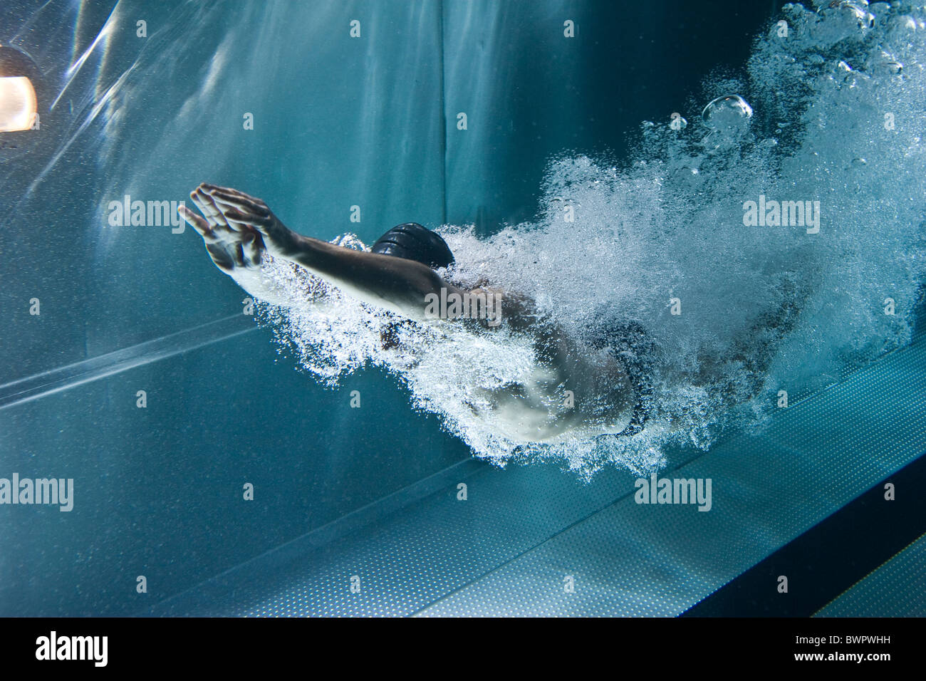professional swimmer underwater after the jump Stock Photo - Alamy