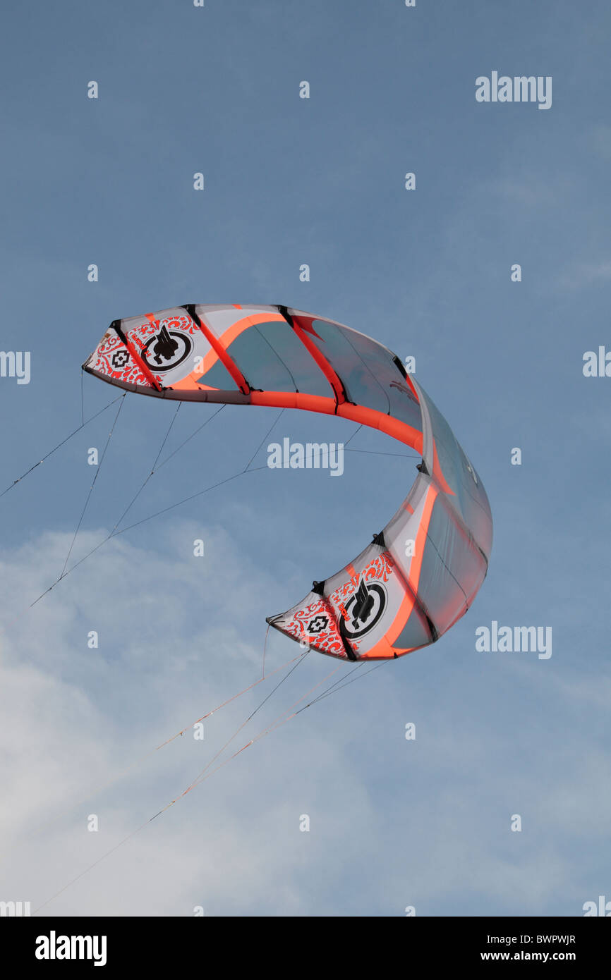 A large kite surfing kite flying above a beach in Rosslare, Wexford ...