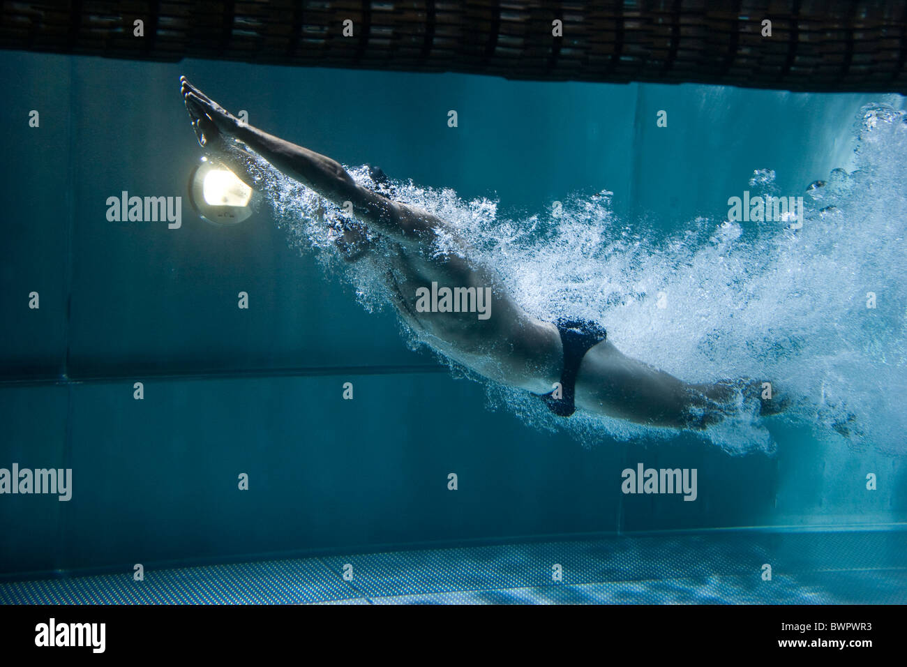 professional swimmer underwater after the jump Stock Photo - Alamy