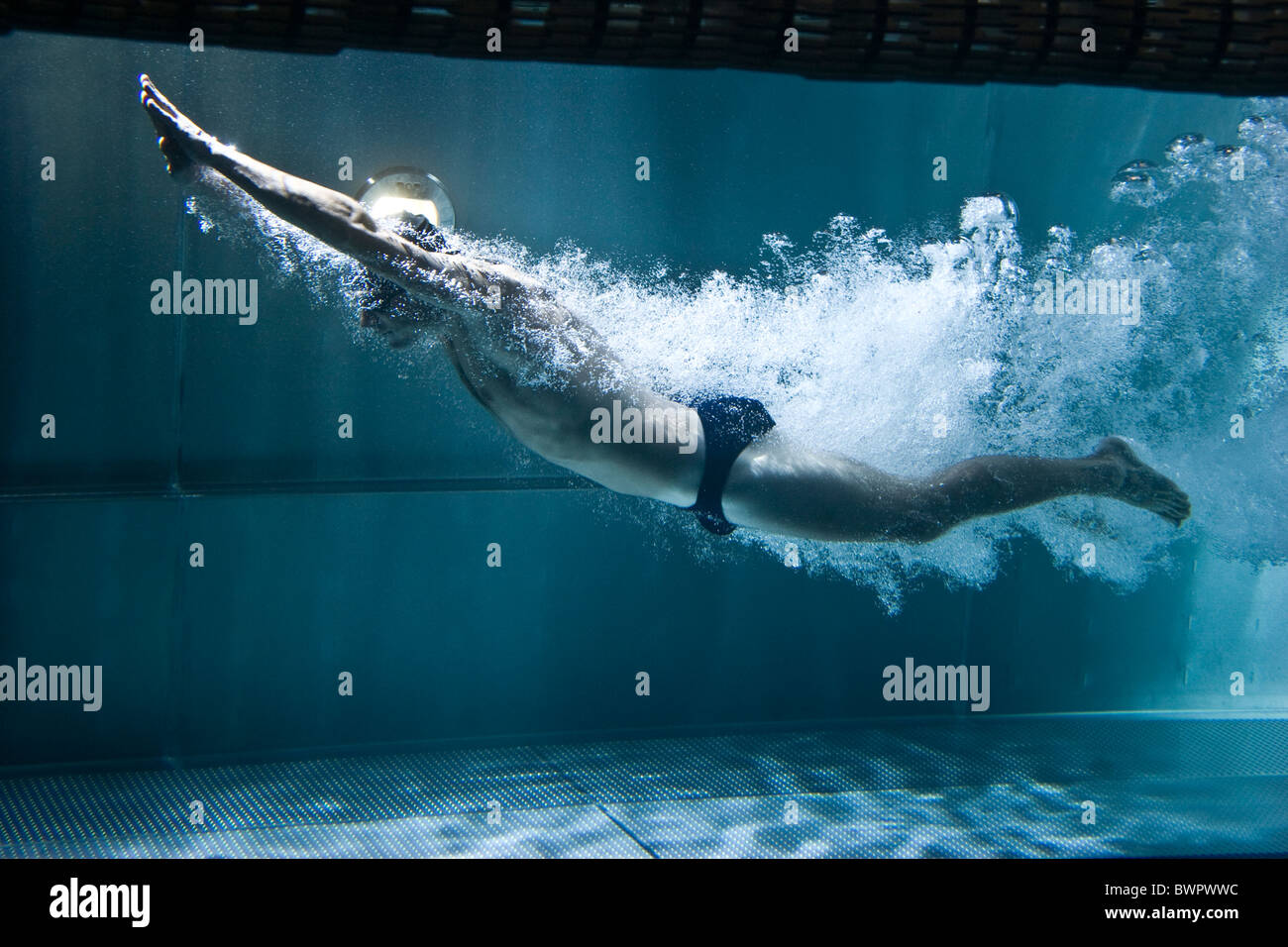 professional swimmer underwater after the jump Stock Photo - Alamy