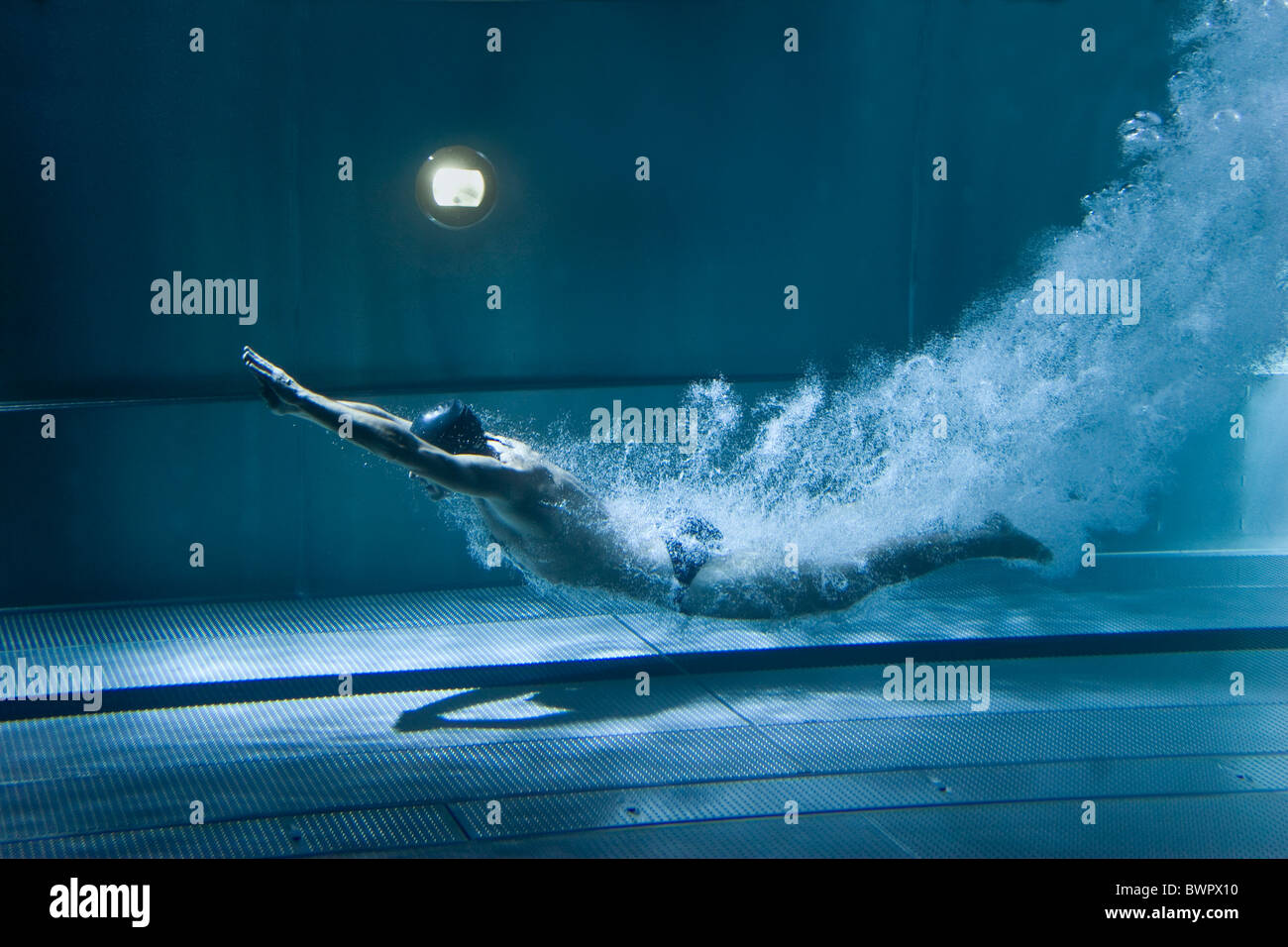 professional swimmer underwater after the jump in swimming pool Stock ...