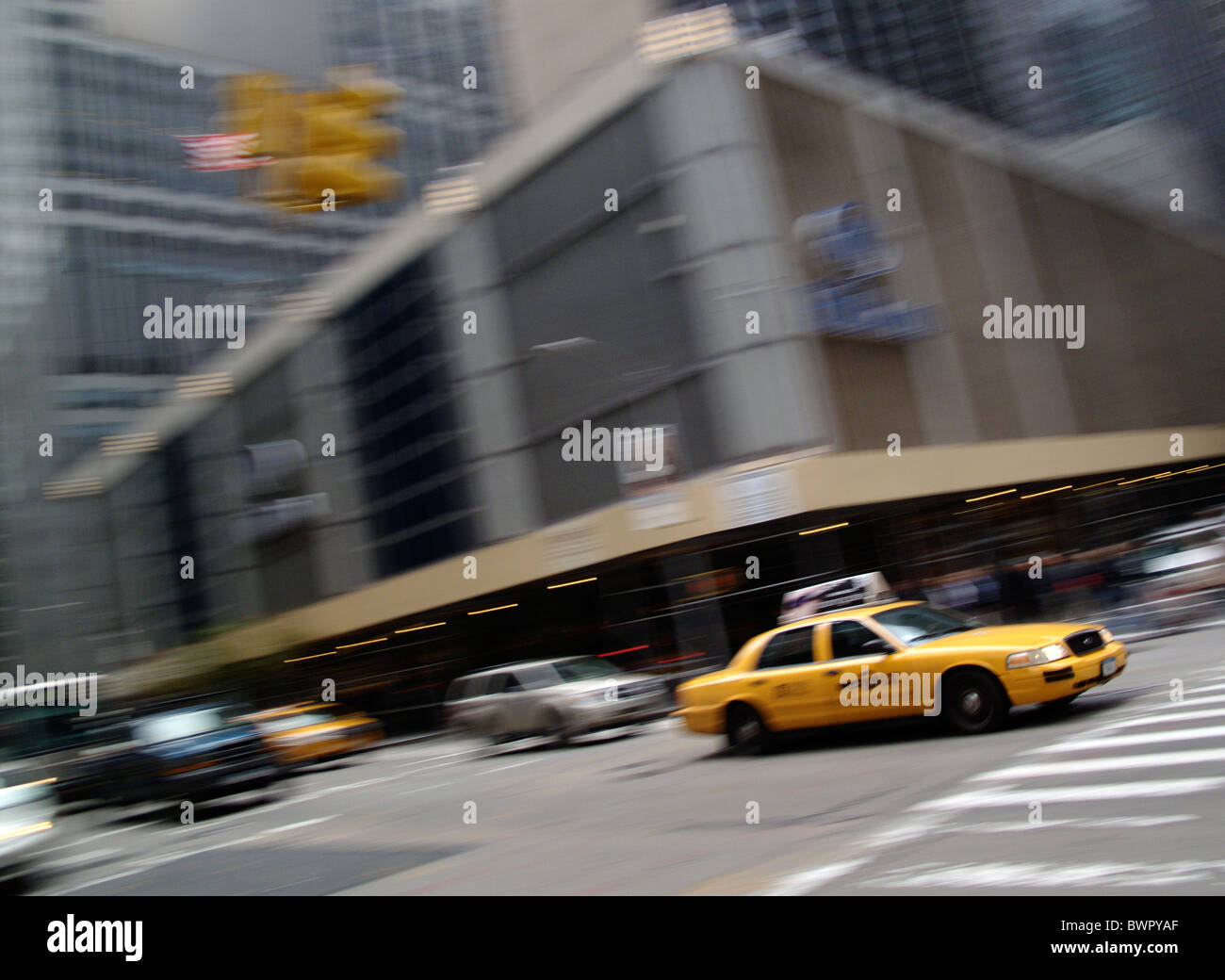 A yellow New York City taxi cab in motion in the United States of ...