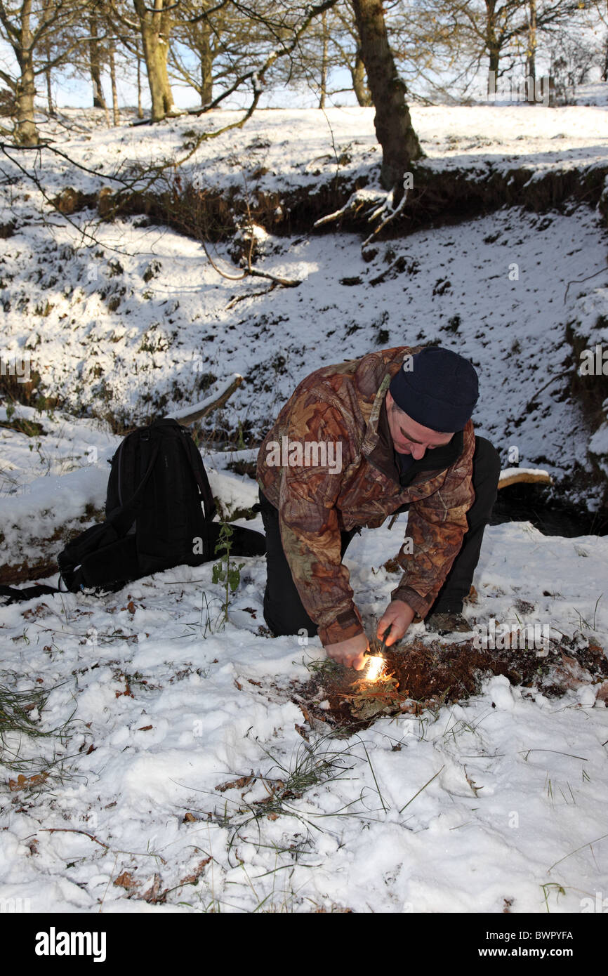 Using a Fire Steel and Birch Bark to Create Fire in a Woodland ...