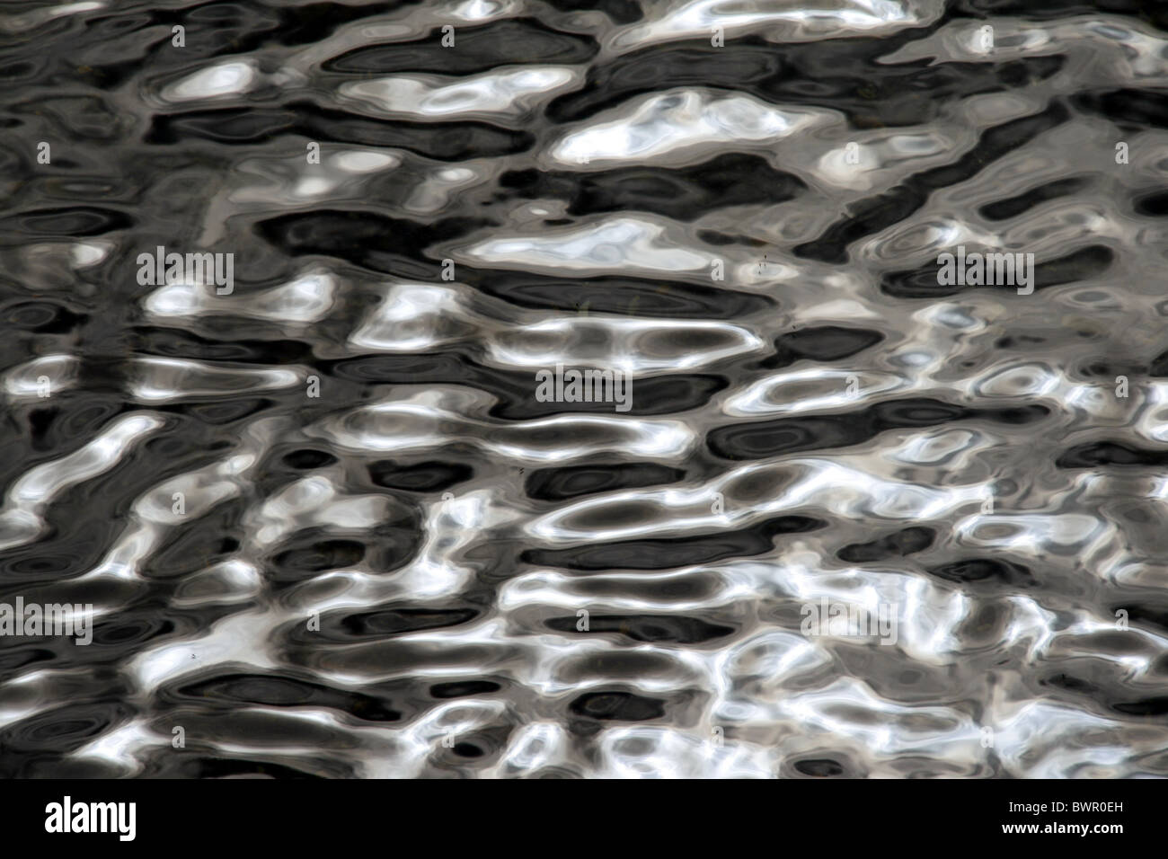 sun light reflection waves on lake water surface Stock Photo - Alamy