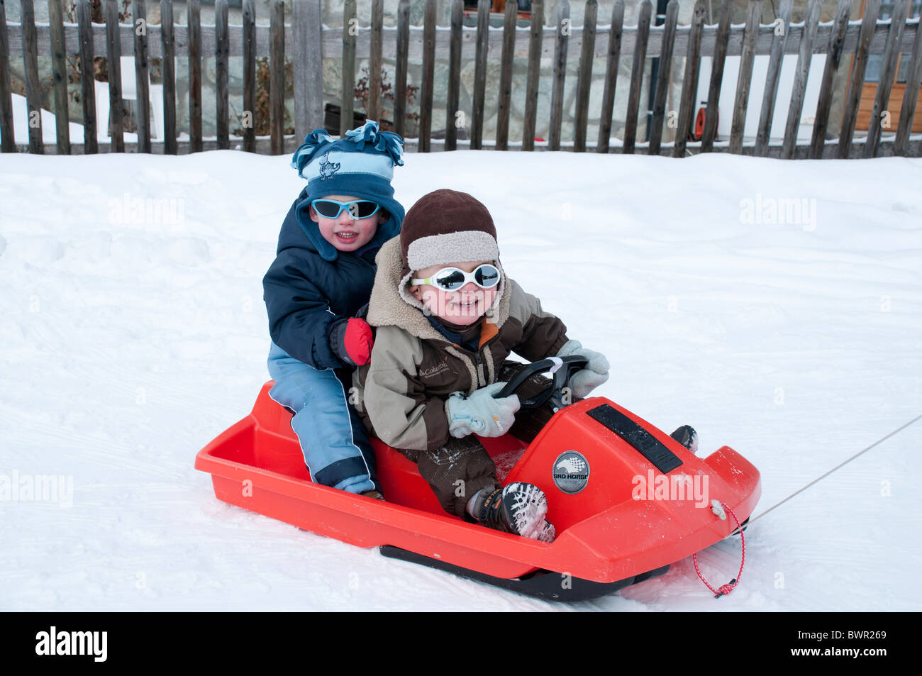 Sledge winter sledging boys fun hi-res stock photography and images - Alamy