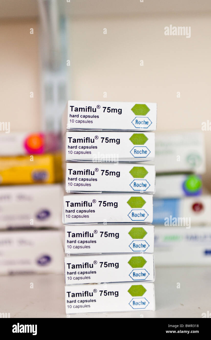 Stack of boxes of Tamiflu anti-viral tablets on a shelf in a pharmacy ...