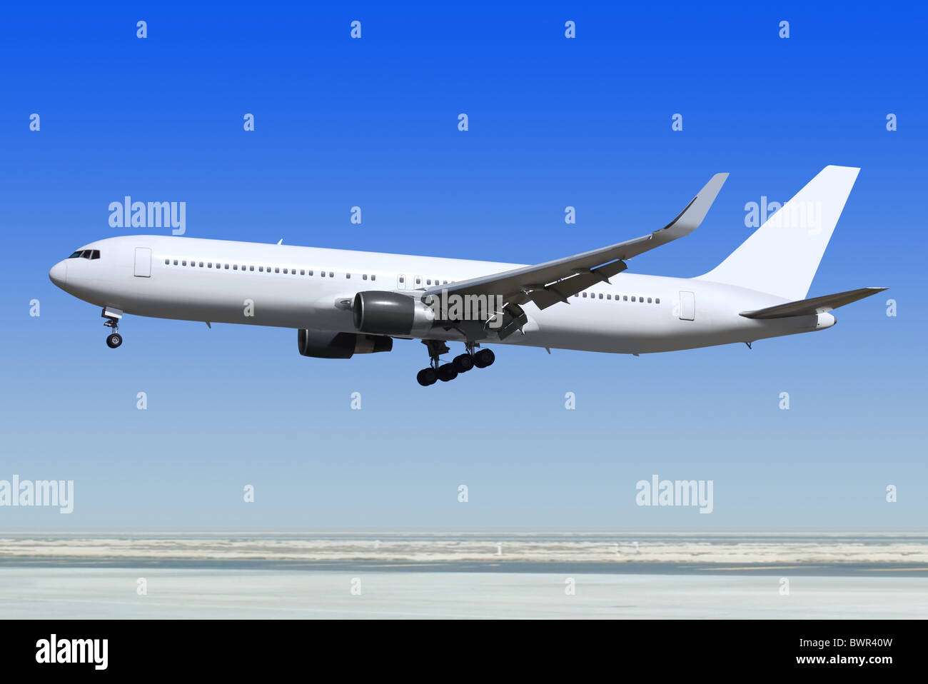 small passenger airplane is landing to runway of airport Stock Photo ...