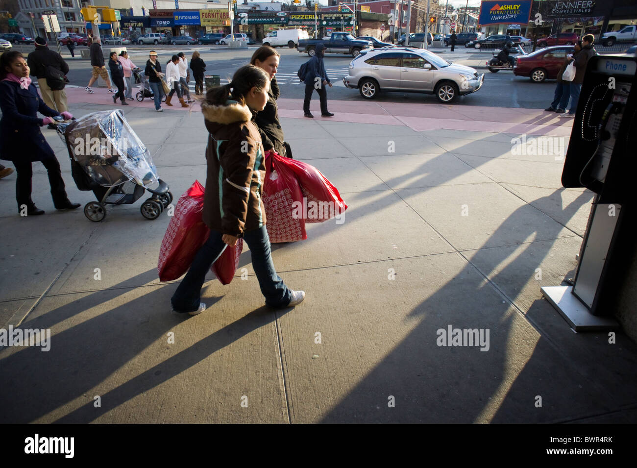 Shoppers with their Target purchases outside the Queens Mall in the ...