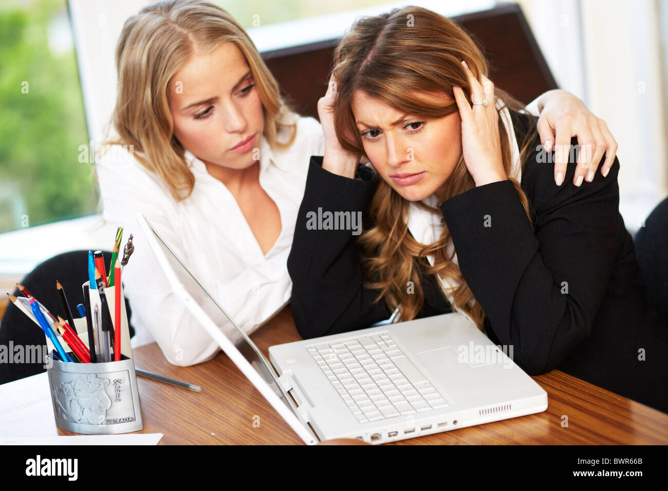 2 girls consoling Stock Photo - Alamy
