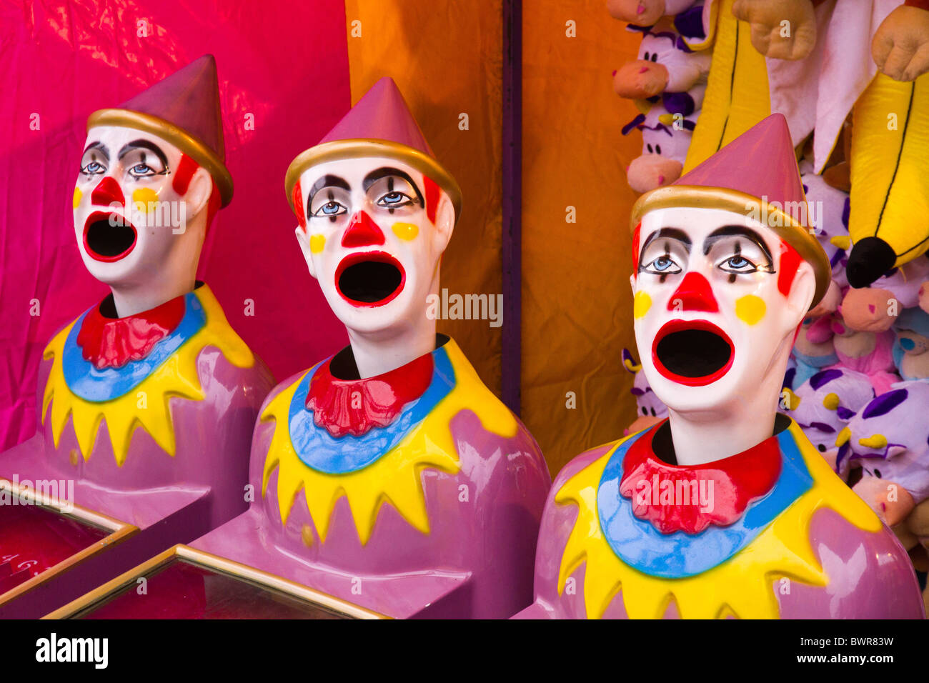 Laughing clowns amusement in sideshow alley Stock Photo - Alamy