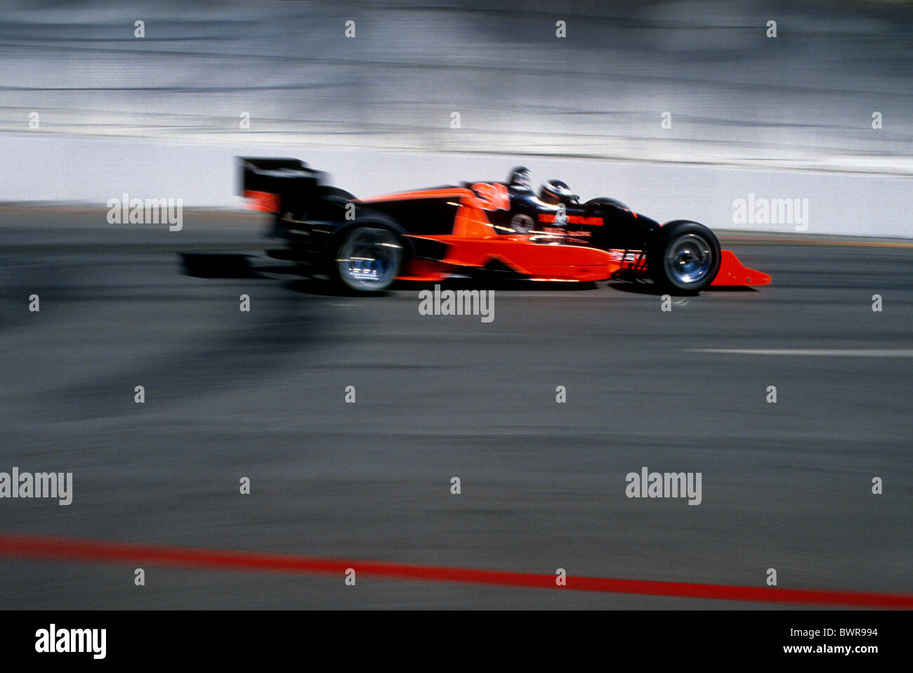 Blurred auto racing action Stock Photo - Alamy