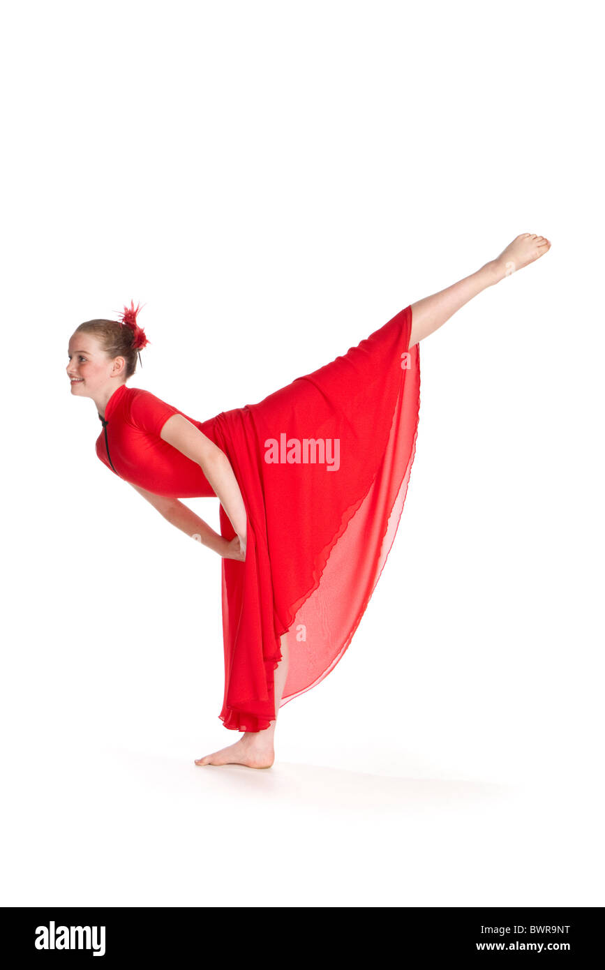 Studio shot of beautiful young girl in red modern lyrical dancing ...