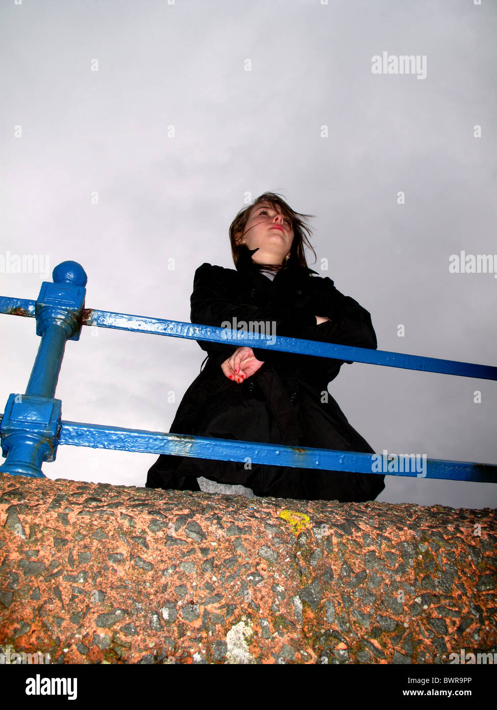 Girl looking over railing hi-res stock photography and images - Alamy