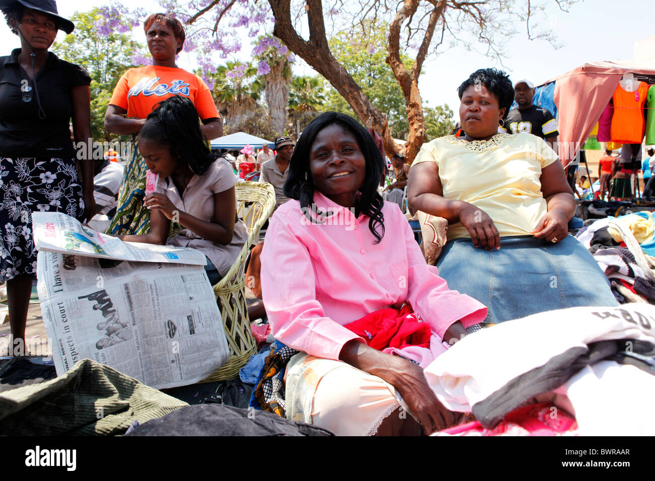 Vendors work at the so-called "bend down market" in Bulawayo, Zimbabwe ...
