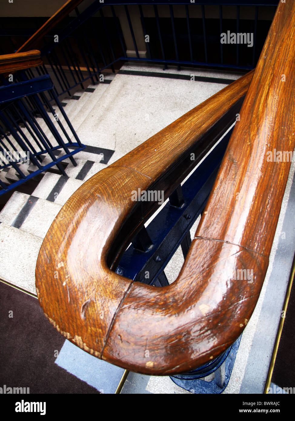 Hardwood handrail on stair in old building Stock Photo - Alamy