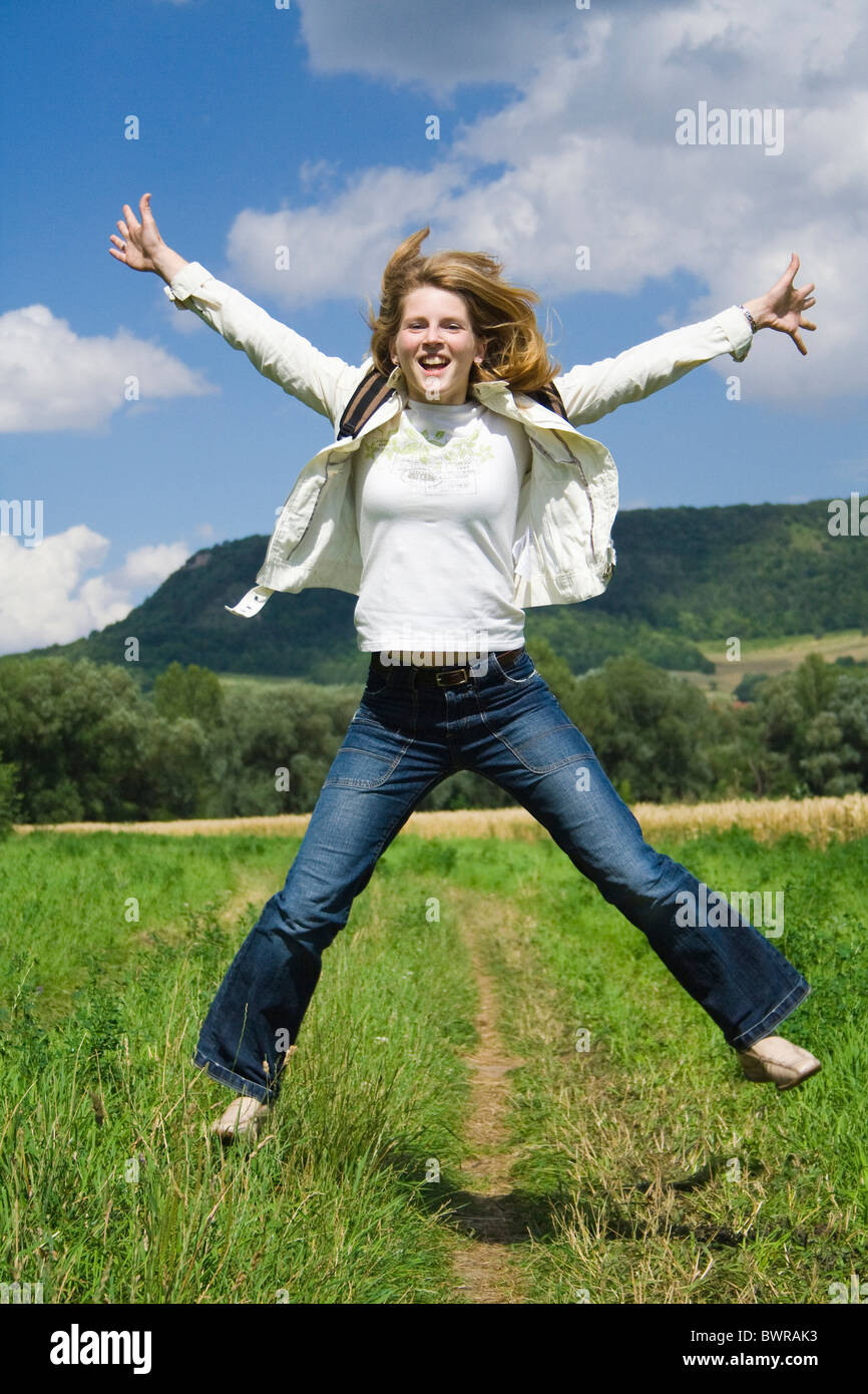 Woman caper lucky jump joy of life falling in love outside outdoors ...