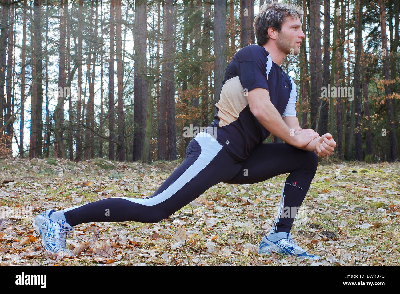 Man Stretching warming up one Person Athlete outdoor outdoors Balance ...