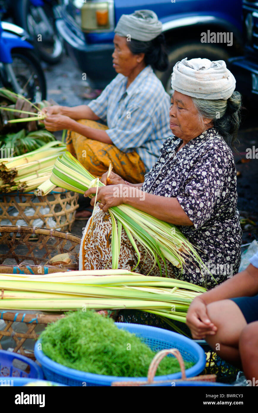 In the early morning hours the market ladies in Bali, Indonesia, sell ...