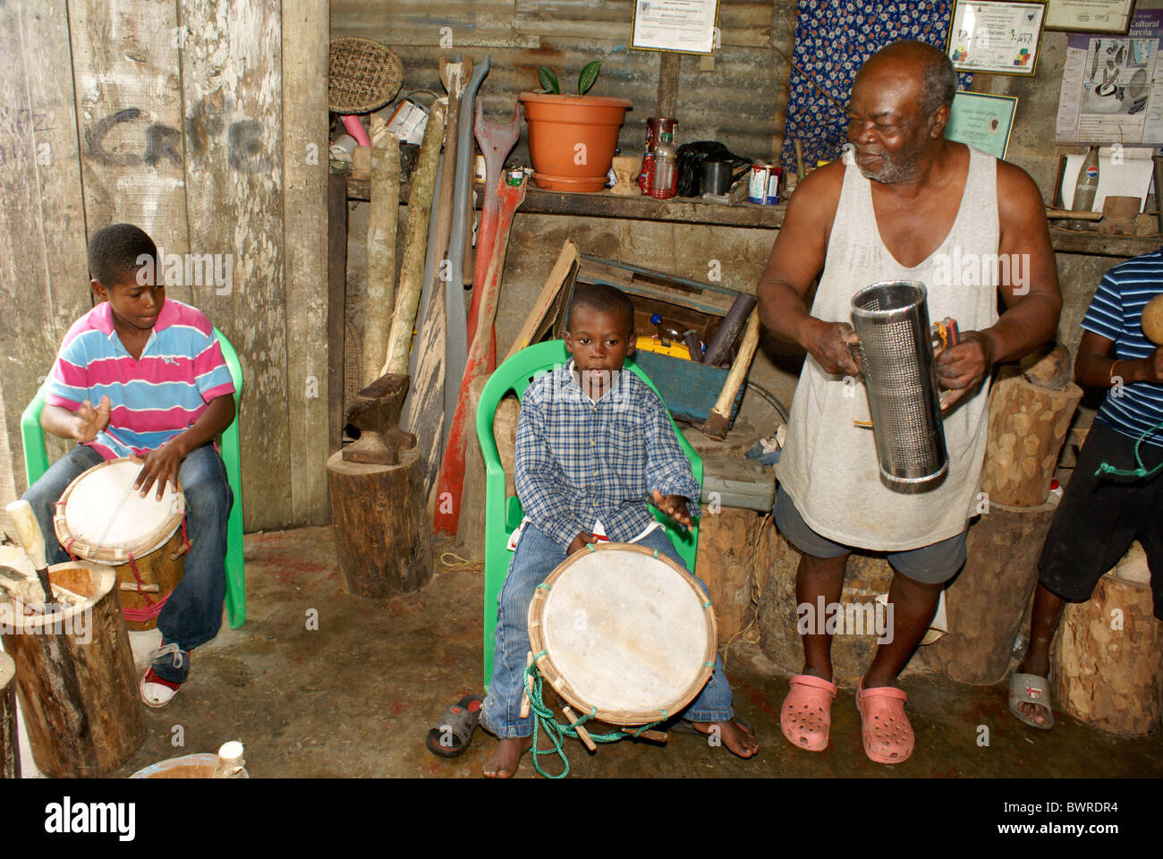 Man and his grandsons playing traditional Garifuna music in the ...