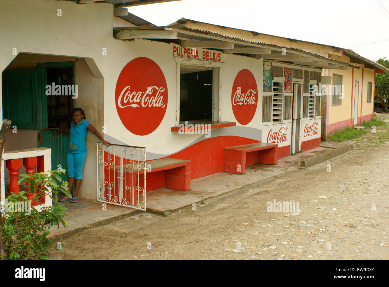Teenage Garifuna girl outside a Pulperia or general store in the ...