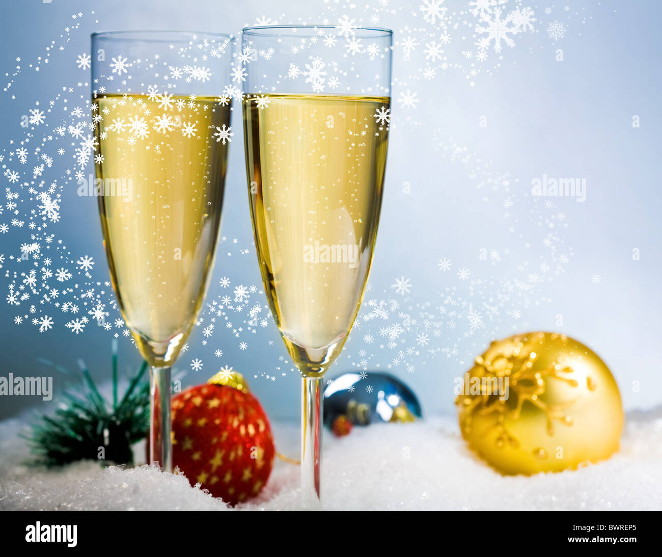 Image of two flutes with champagne in snow Stock Photo - Alamy