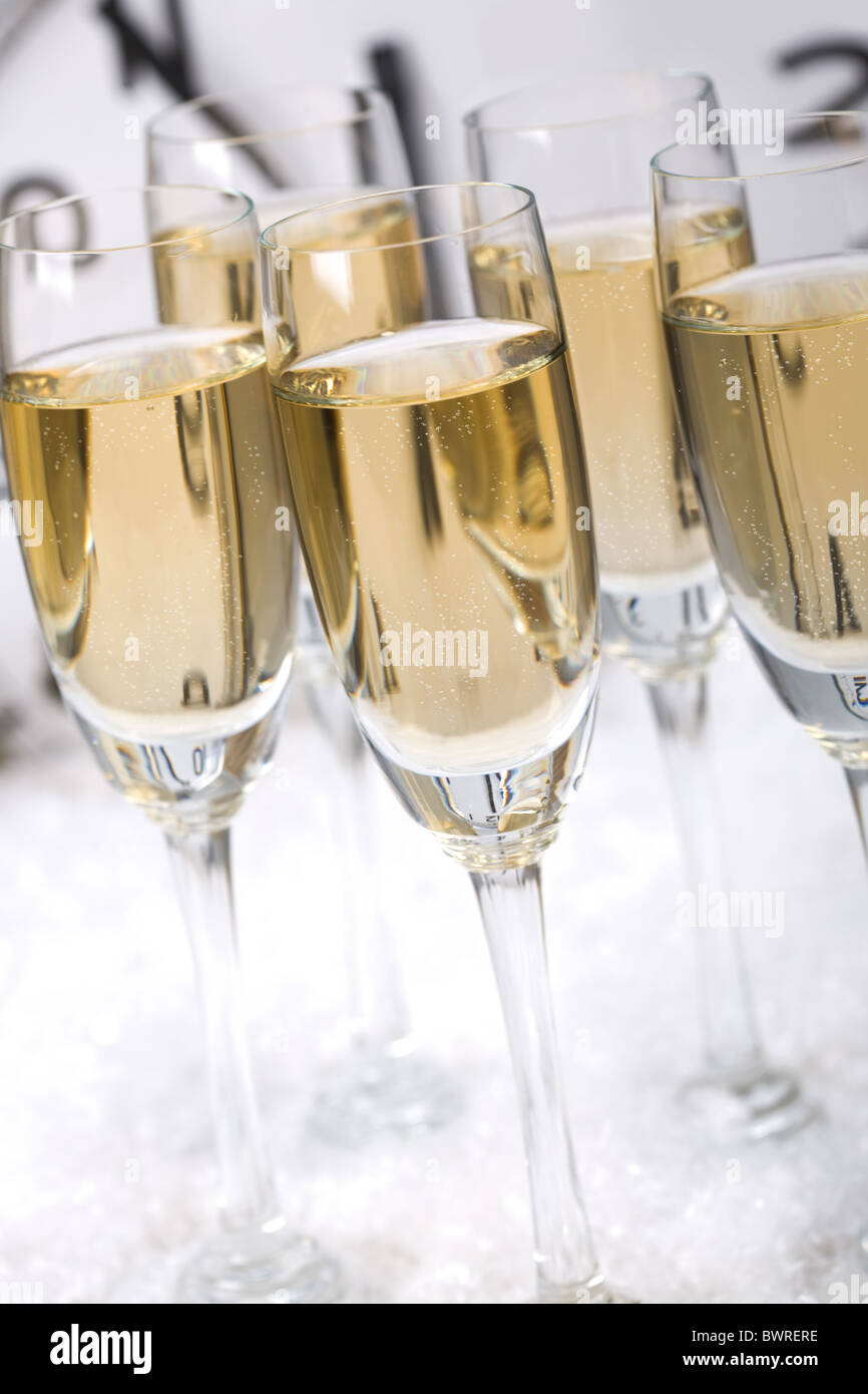 Close-up of flutes of champagne in snow Stock Photo - Alamy
