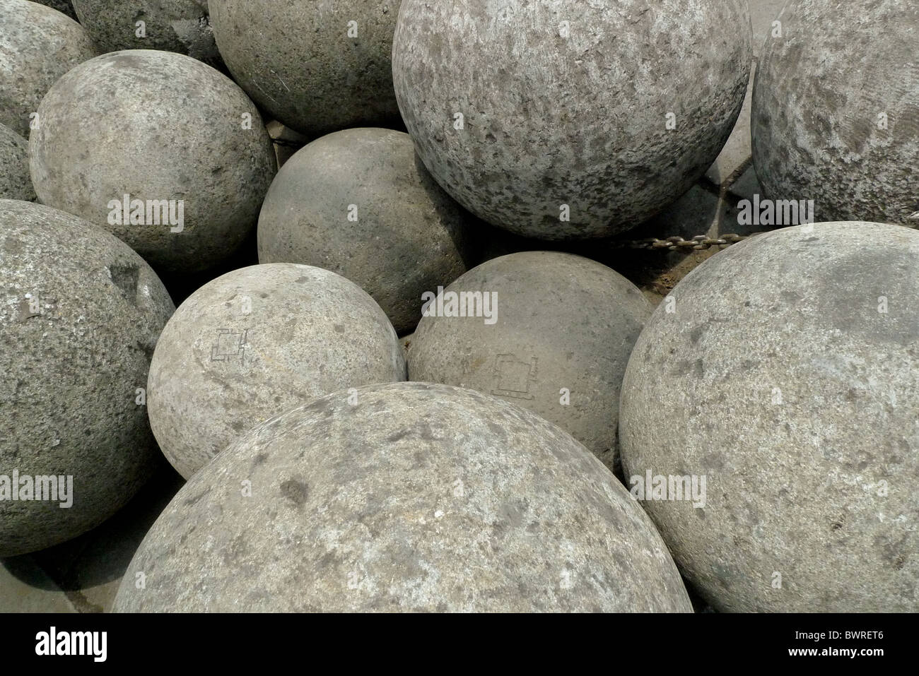 balls of stone, in differing sizes and weights Stock Photo - Alamy