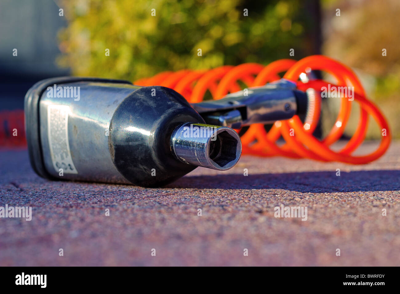 Photograph taken during a tyre fitting, using compressed air tools ...