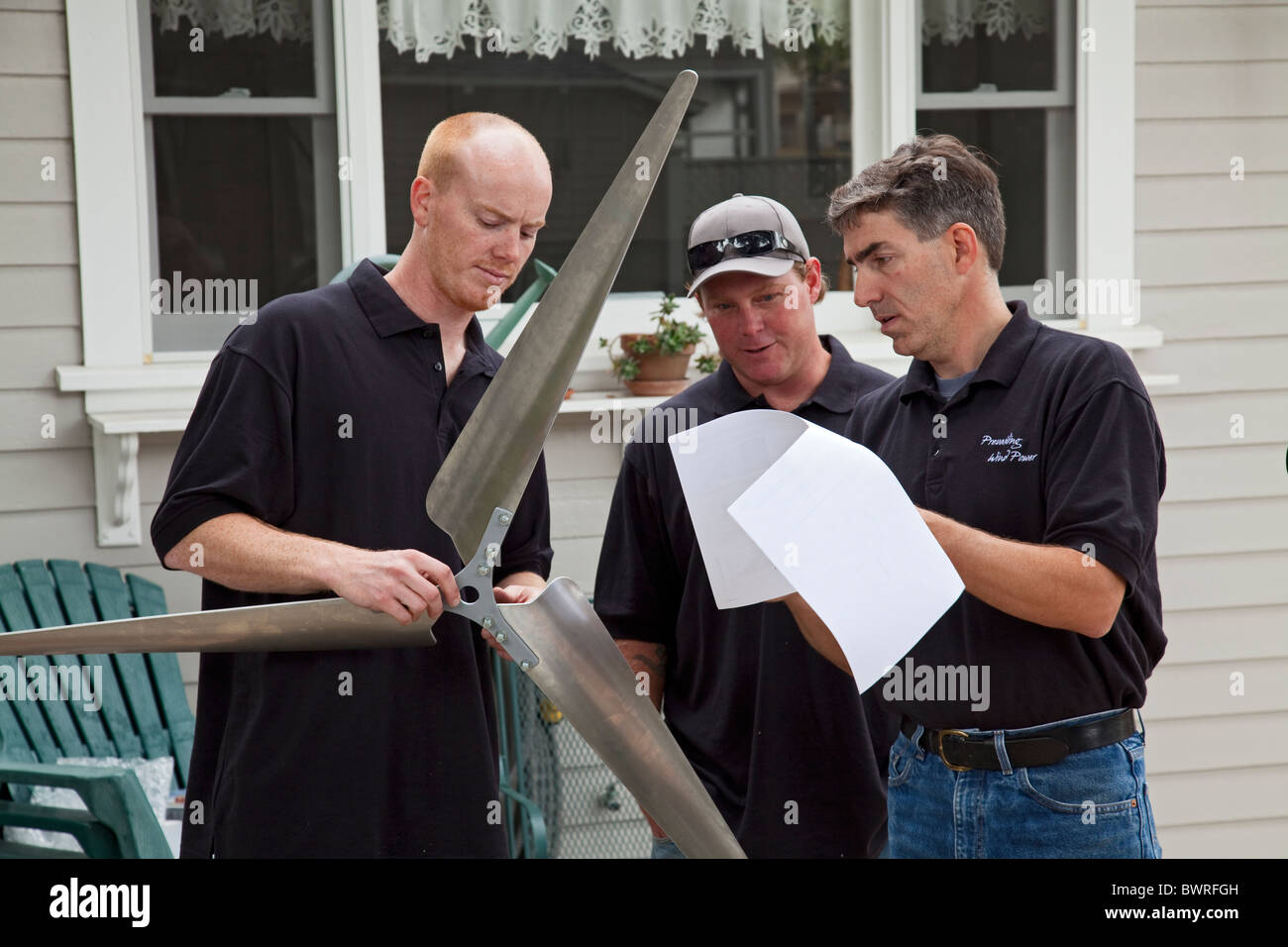 Installation of a residential wind turbine is filmed for an episode of ...