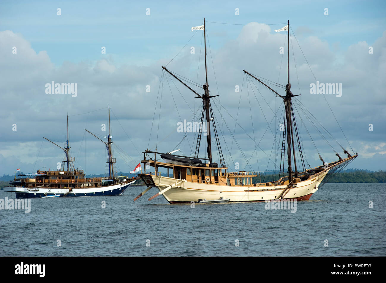 Dive charter boats in Sorong Bay, Raja Ampat Indonesia Stock Photo - Alamy