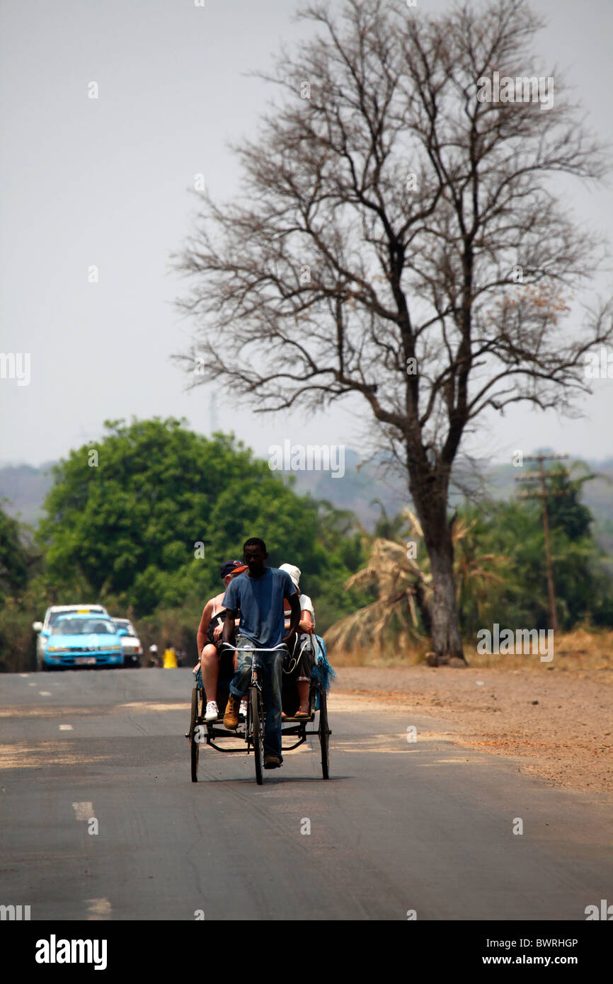 A bicycle rickshaw driver gives a life to two western tourists at ...