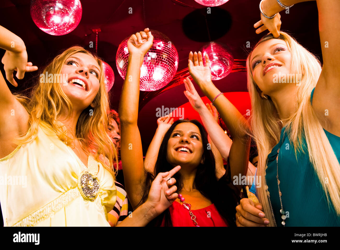 Several smart dancers moving at disco and having fun Stock Photo - Alamy