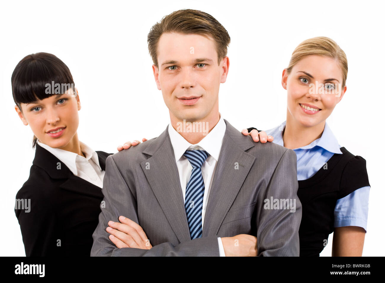 Portrait of business partners looking at camera with successful man in ...