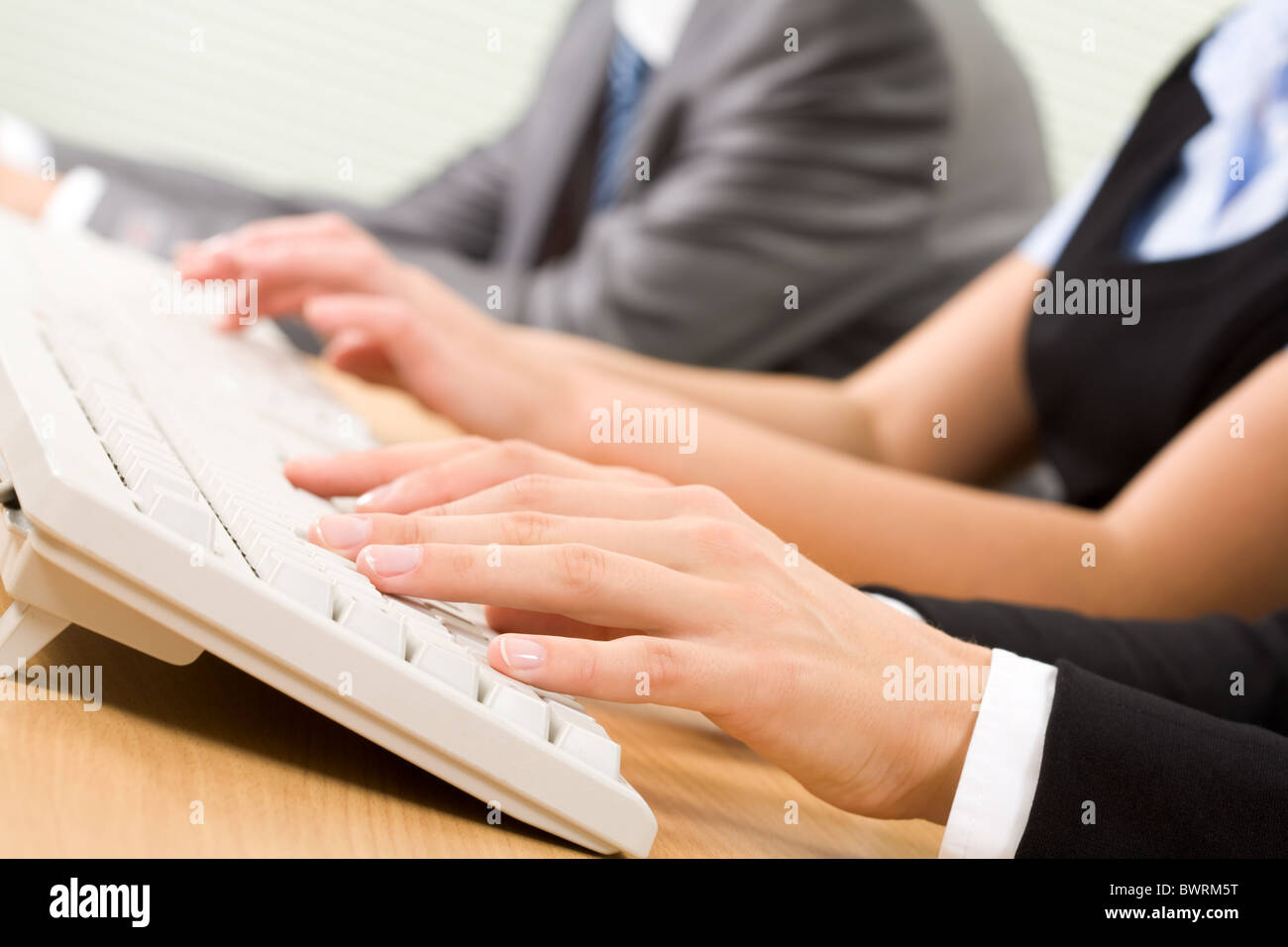 Image of female’s hands pushing buttons of computer keyboard in office ...