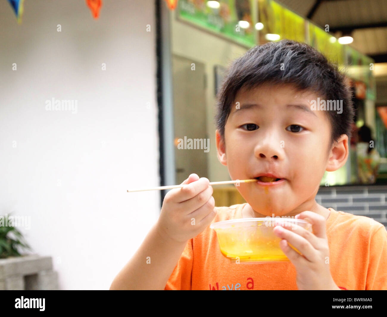 Greedy boy hi-res stock photography and images - Alamy