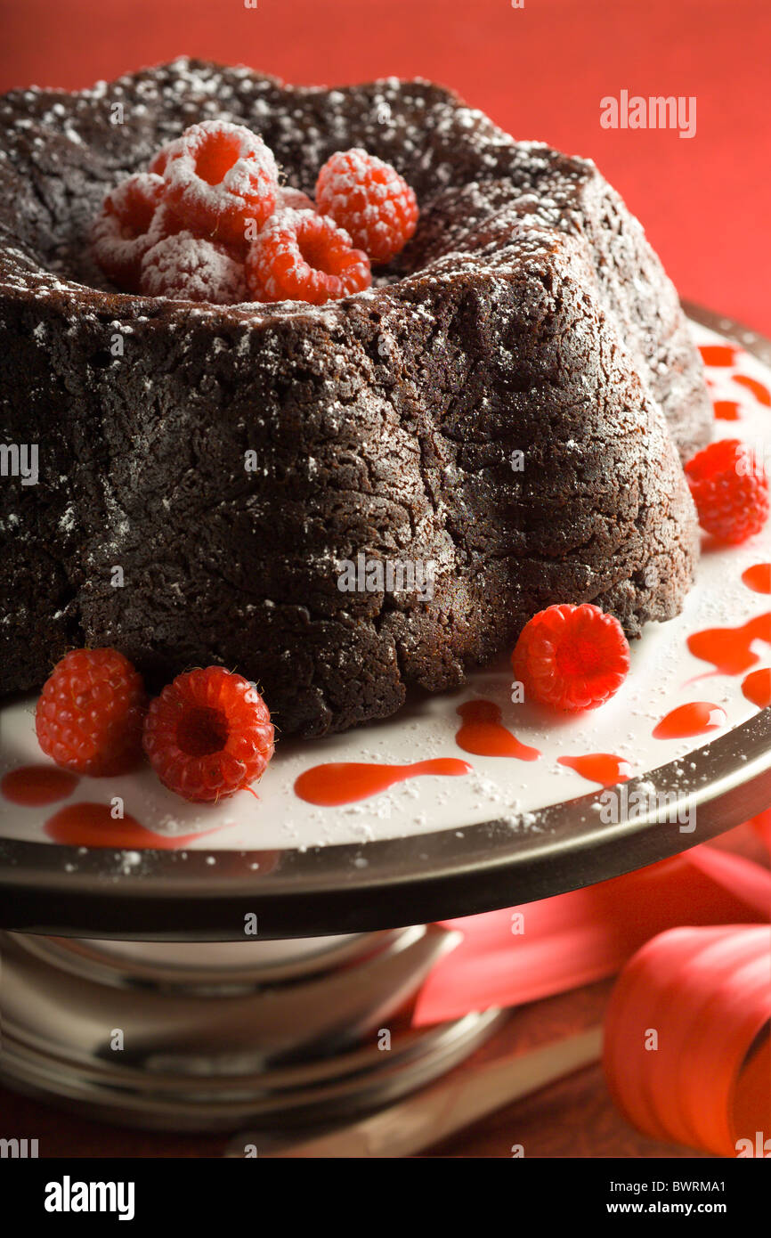 Chocolate Fudge Cake with Raspberry Coulis Stock Photo - Alamy