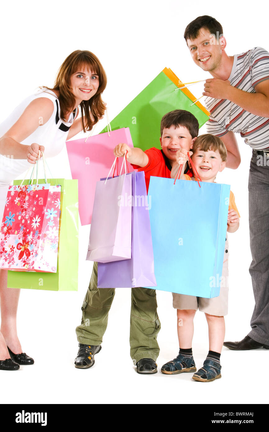Image of cheerful family members standing next to each other with happy ...