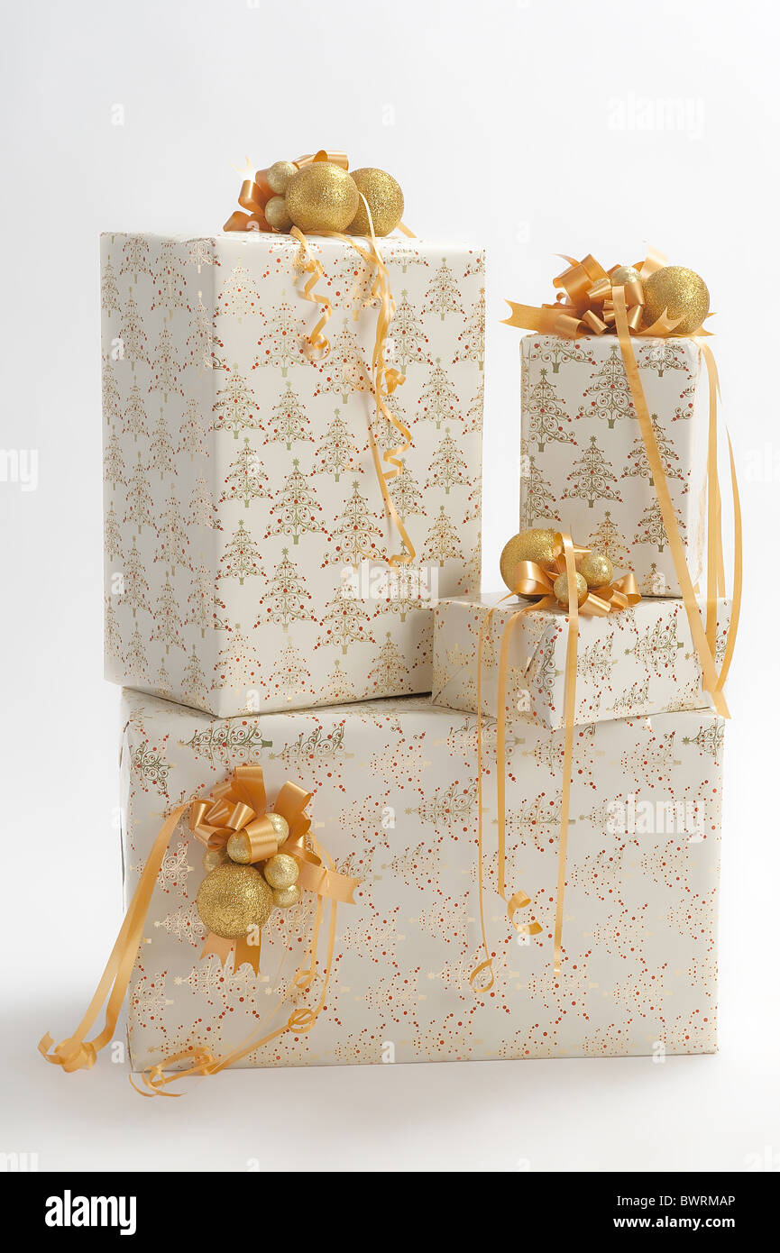 Four gift box with toys isolated on white background Stock Photo - Alamy