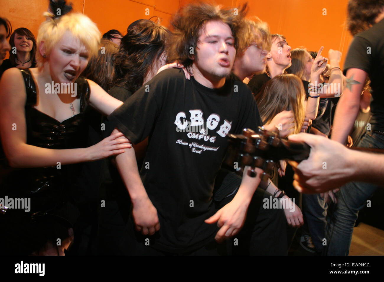 Metal fans at a music video shoot/gig Stock Photo - Alamy