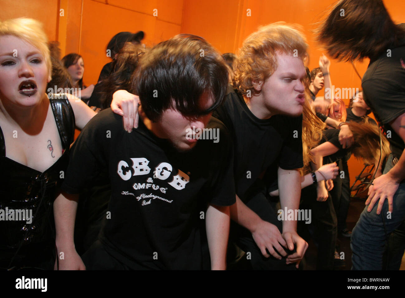 Metal fans at a music video shoot/gig Stock Photo - Alamy