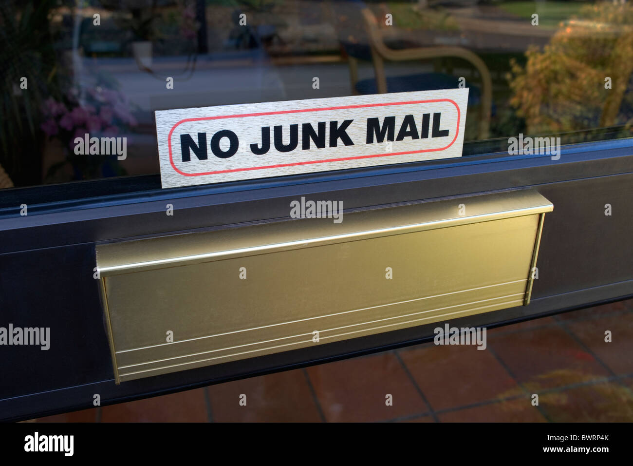 A domestic letterbox with a notice saying : No junk mail Stock Photo ...