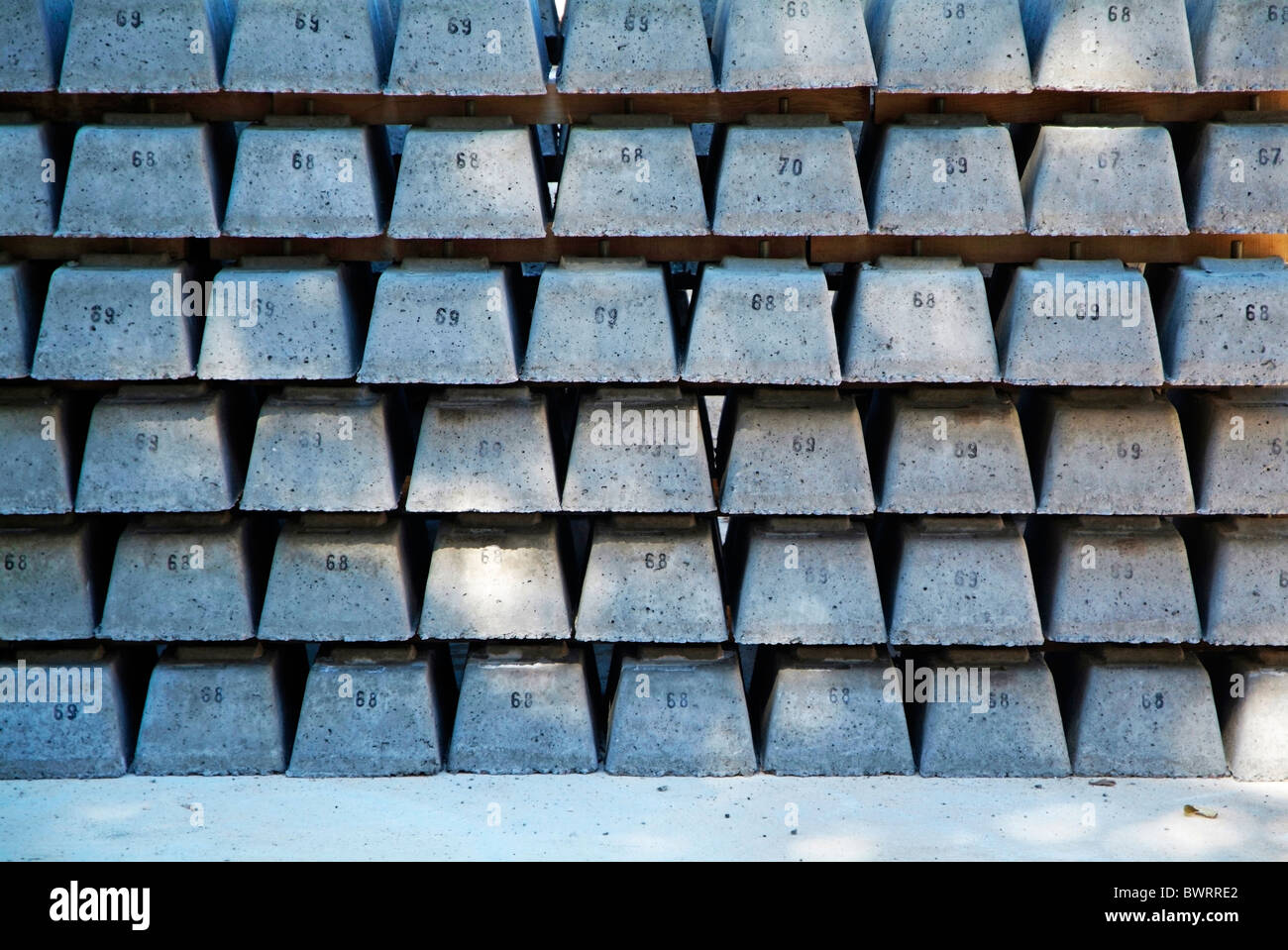 Pile of cement bricks ready for the new tramway line under construction ...