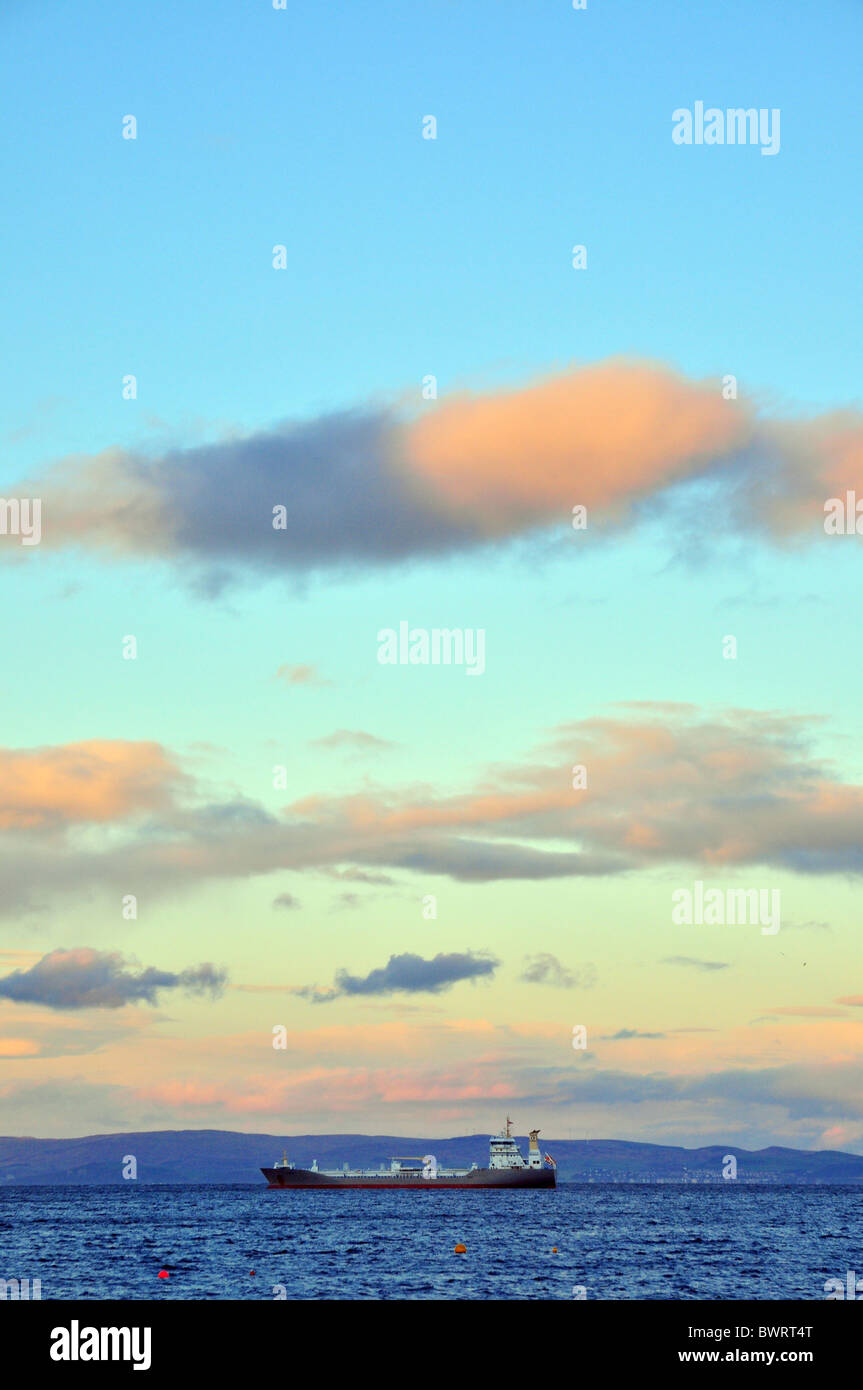 Ship at sea at sunset, Firth of Clyde, Scotland, UK Stock Photo - Alamy